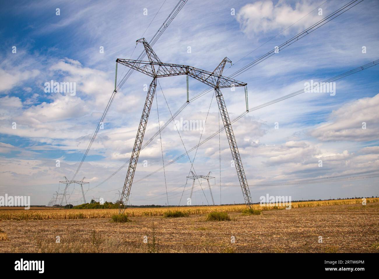 Power transmission tower in Ukraine in summer. Overhead wires of high ...