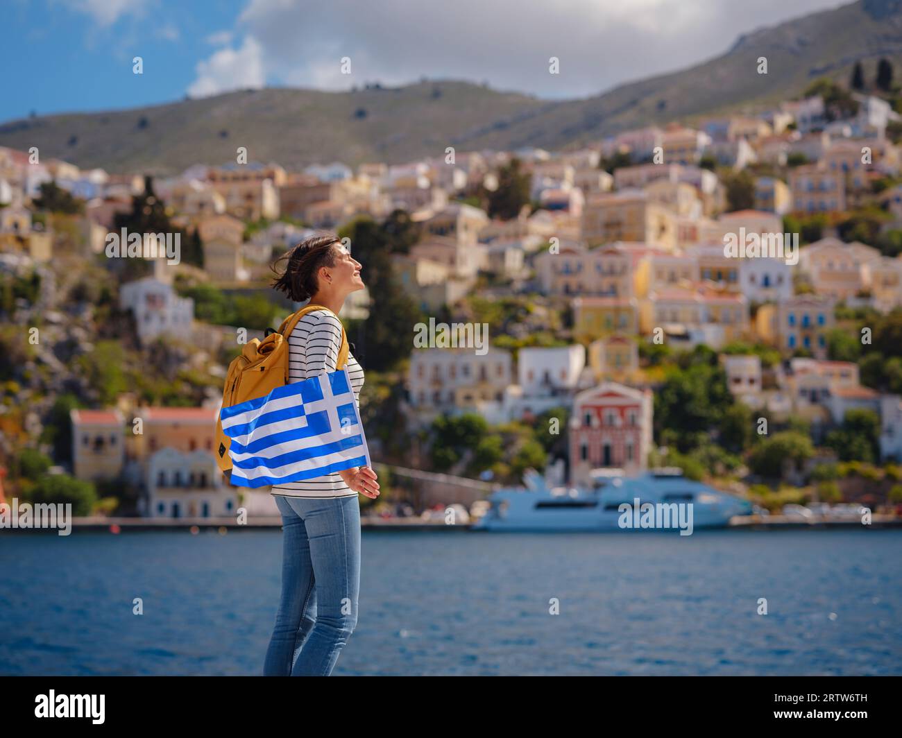 Nice asian Happy Female with backpack anf greek flag Enjoying her ...