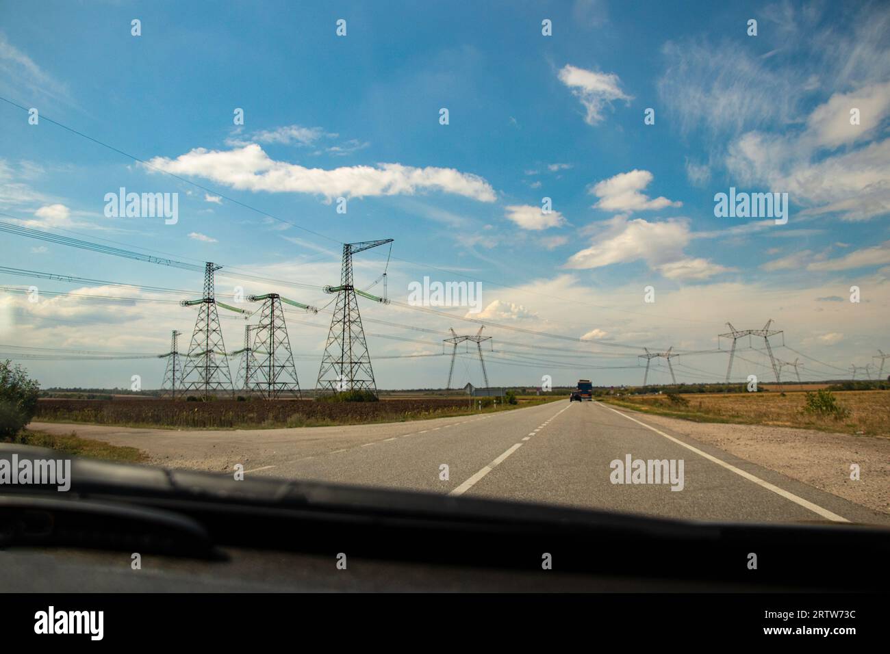Power transmission tower in Ukraine in summer. Overhead wires of high ...