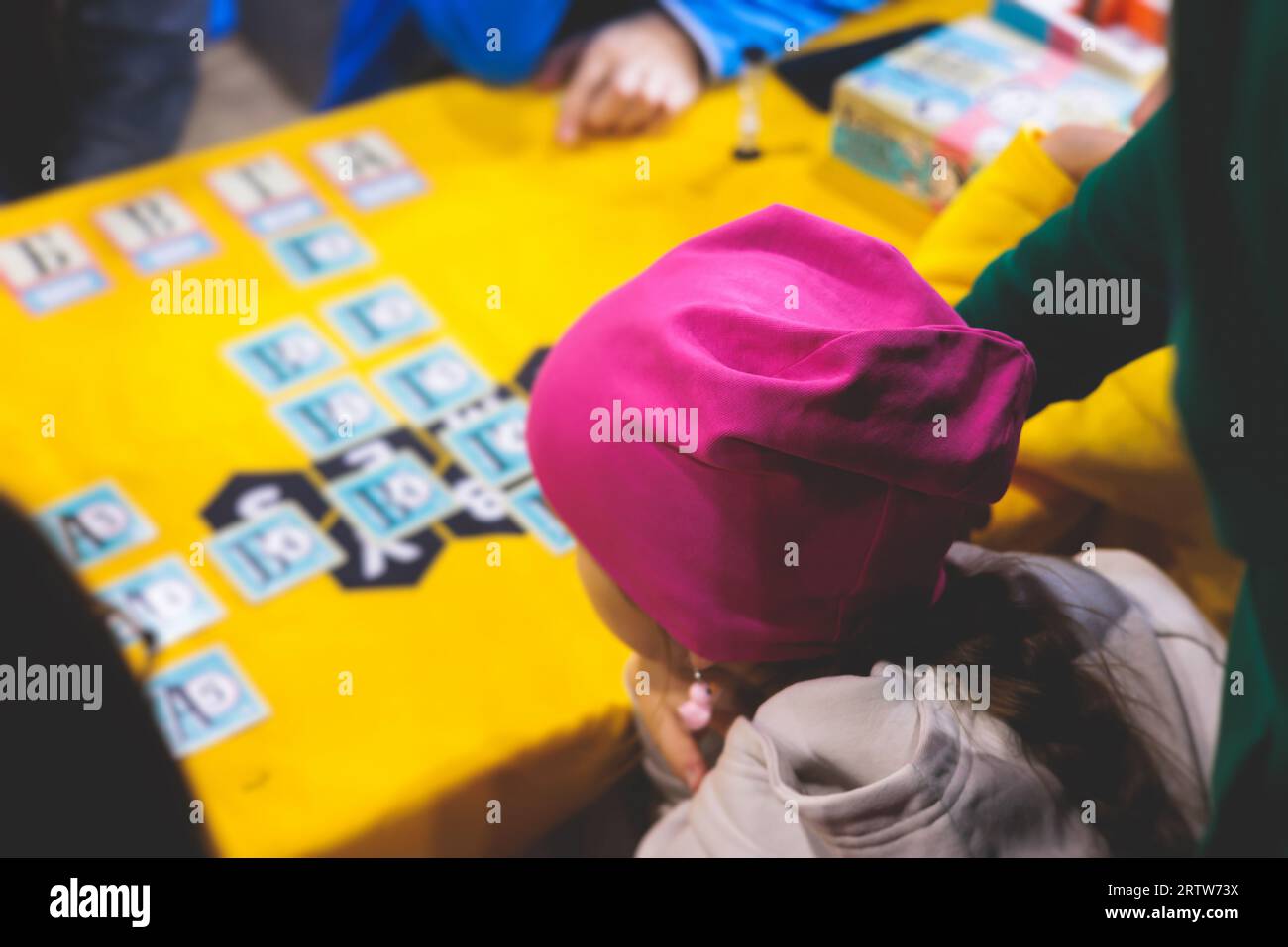 Process of playing board game and having fun with friends and family in ...