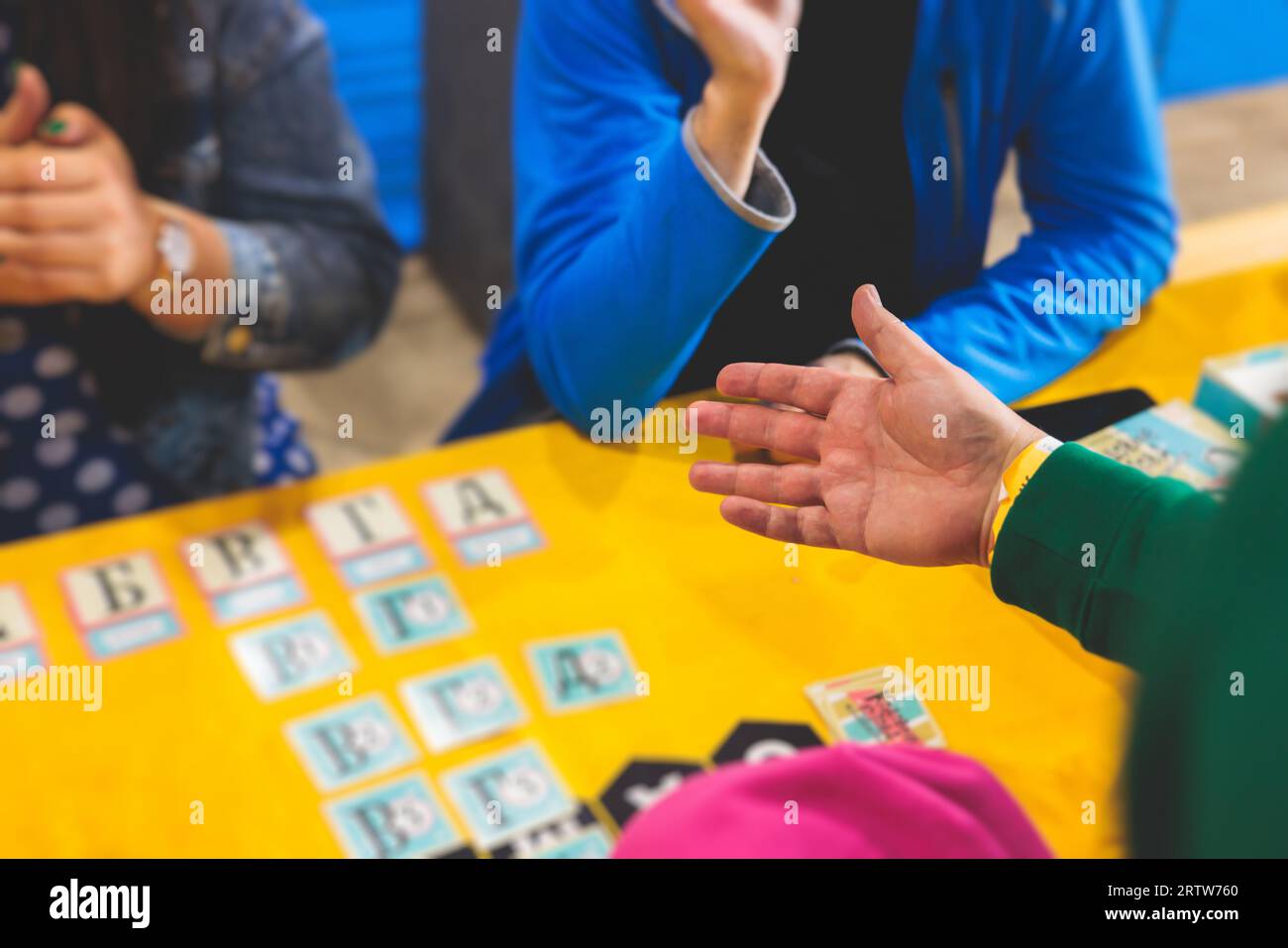 Process of playing board game and having fun with friends and family in ...