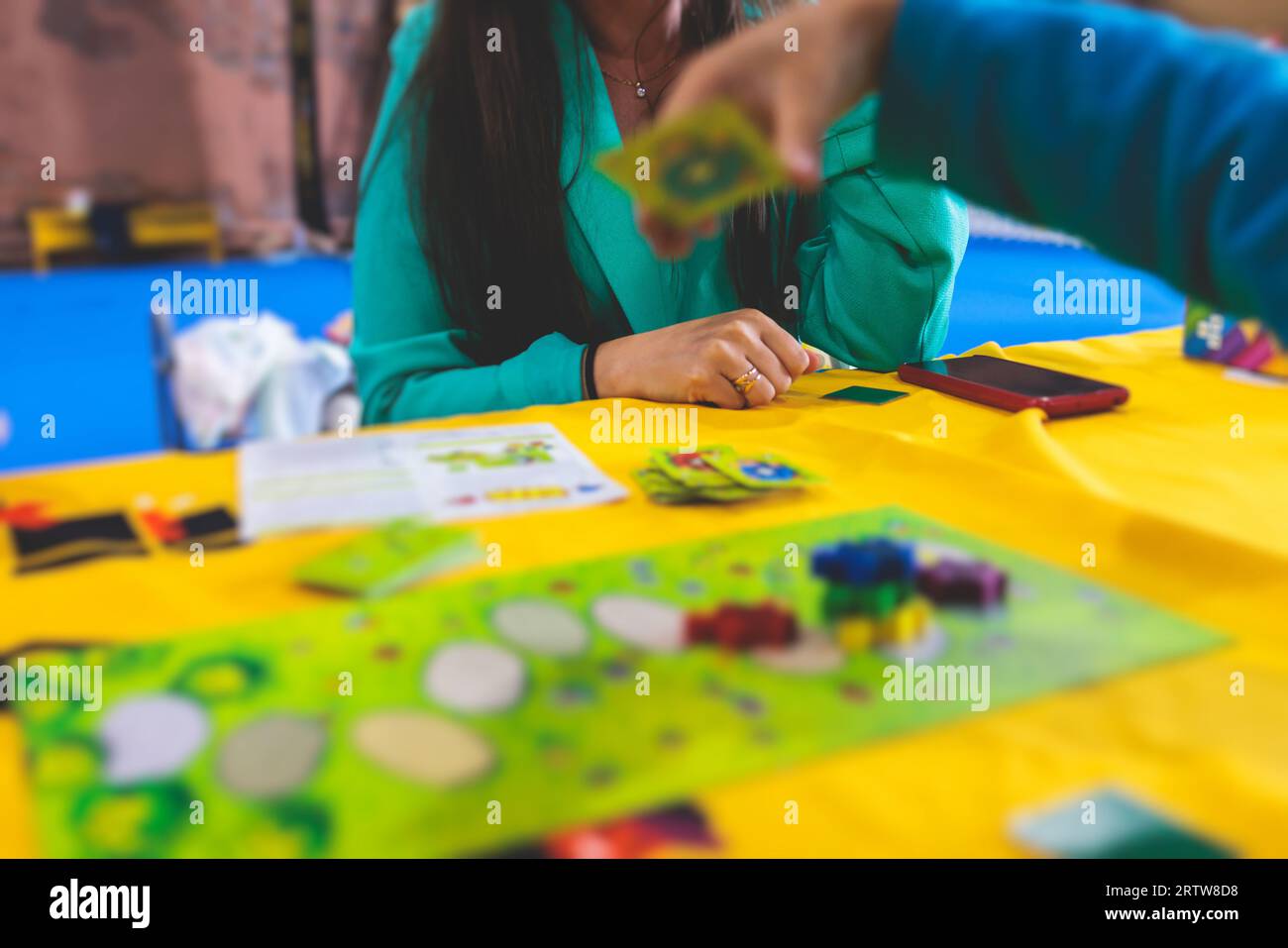 Process of playing board game and having fun with friends and family in ...