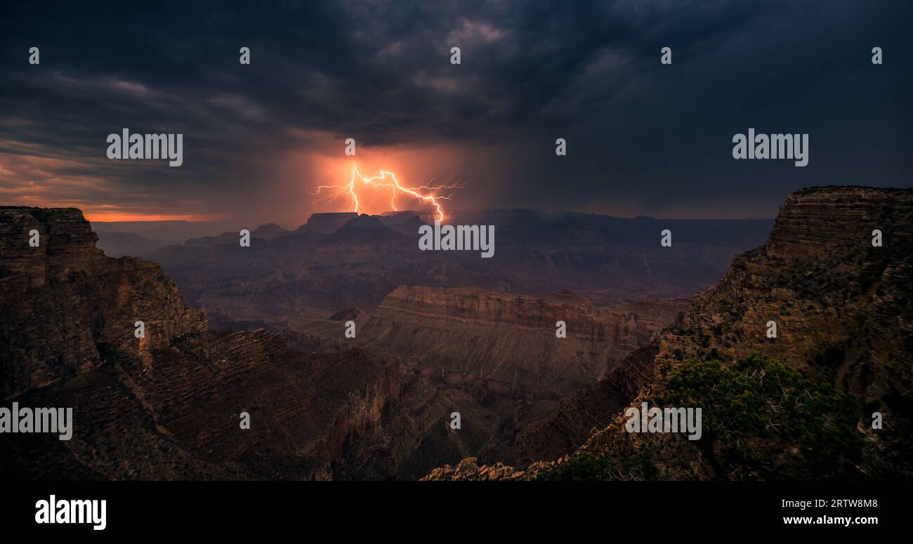 Lightning strikes from a thunderstorm at the Grand Canyon at twilight ...
