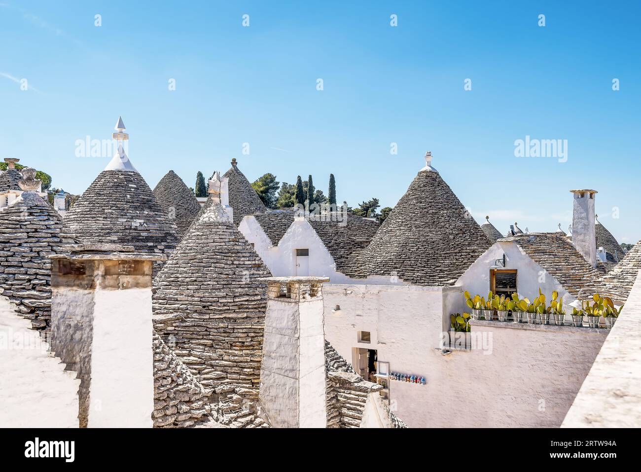 Scenic view of trulli whitewashed huts with conical roofs in ...
