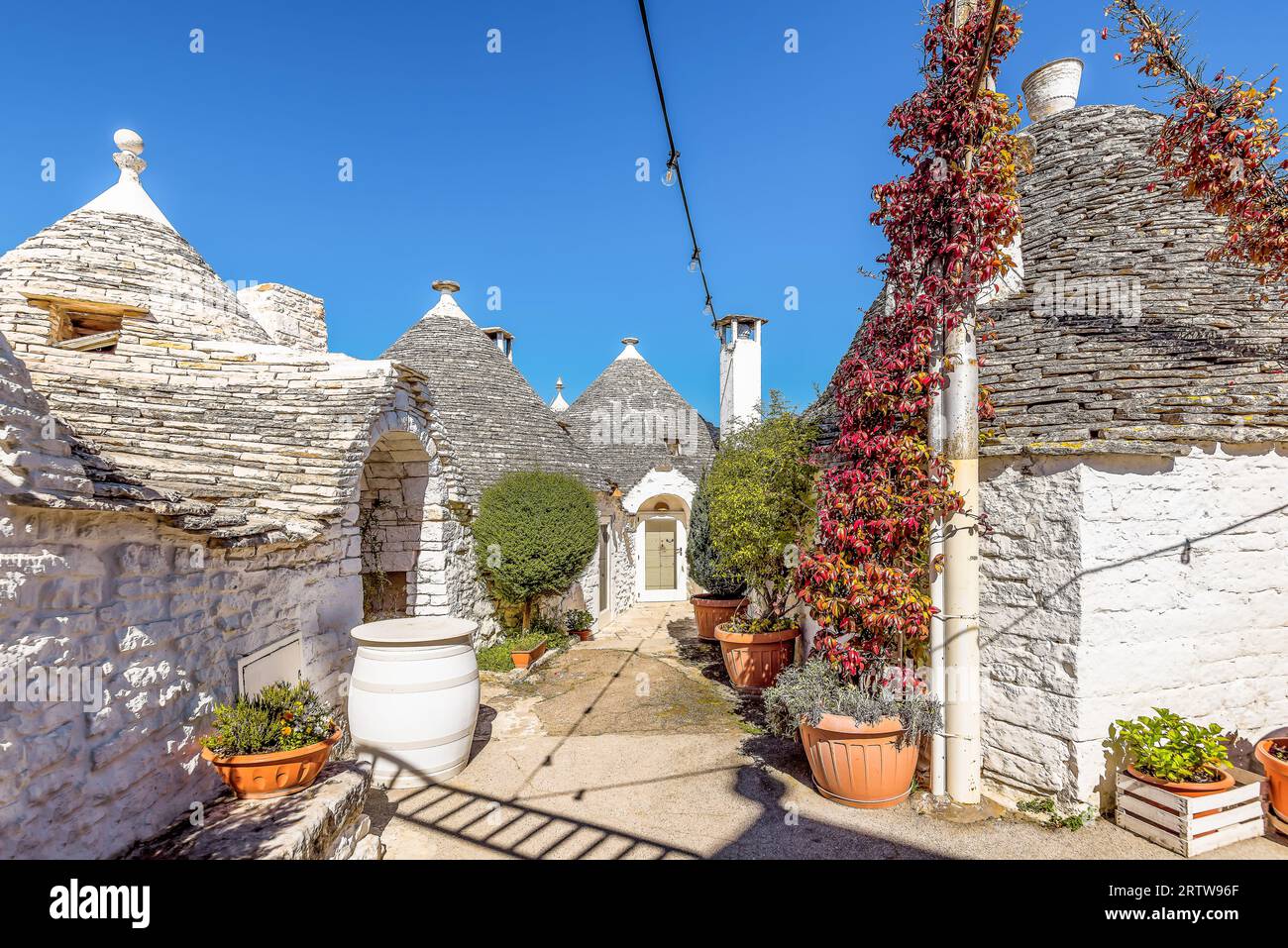 Scenic view of trulli whitewashed huts with conical roofs in ...
