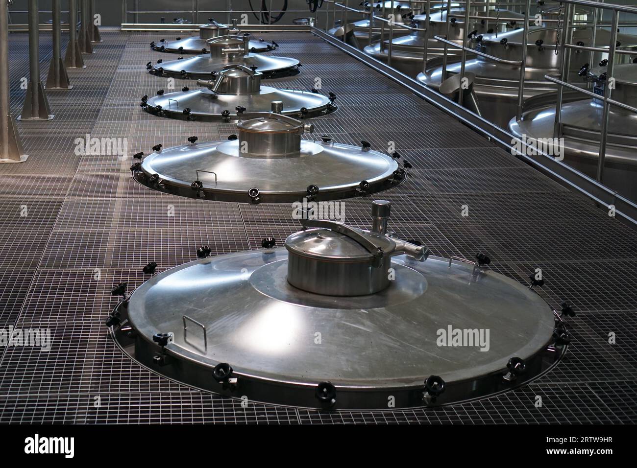 Top cover stainless steel wine vats in the winery Stock Photo - Alamy