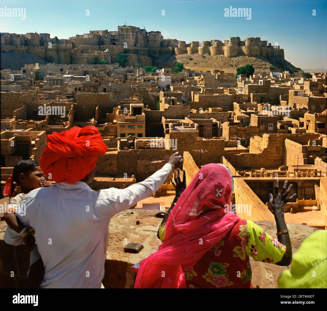 Three people look out at the city Stock Photo - Alamy