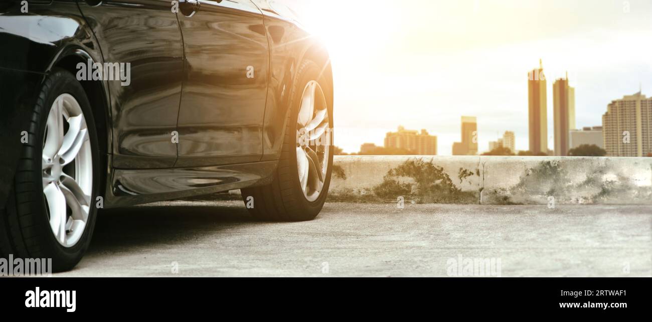 Close up of black car on background of cityscape with sunlight, car ...