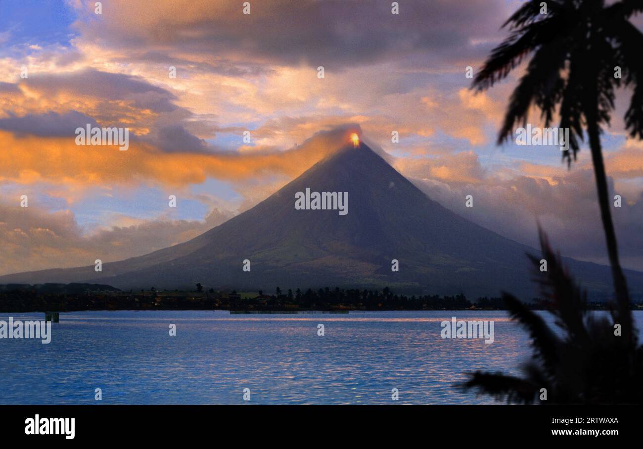 Mayon volcano near Legazpi City - eruption at sunset Stock Photo - Alamy
