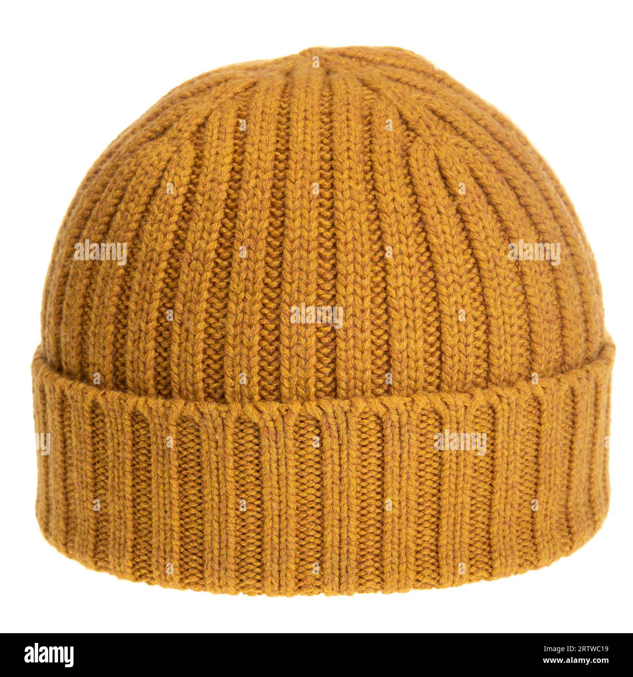Pale orange knitted winter bobble hat of traditional design isolated on ...