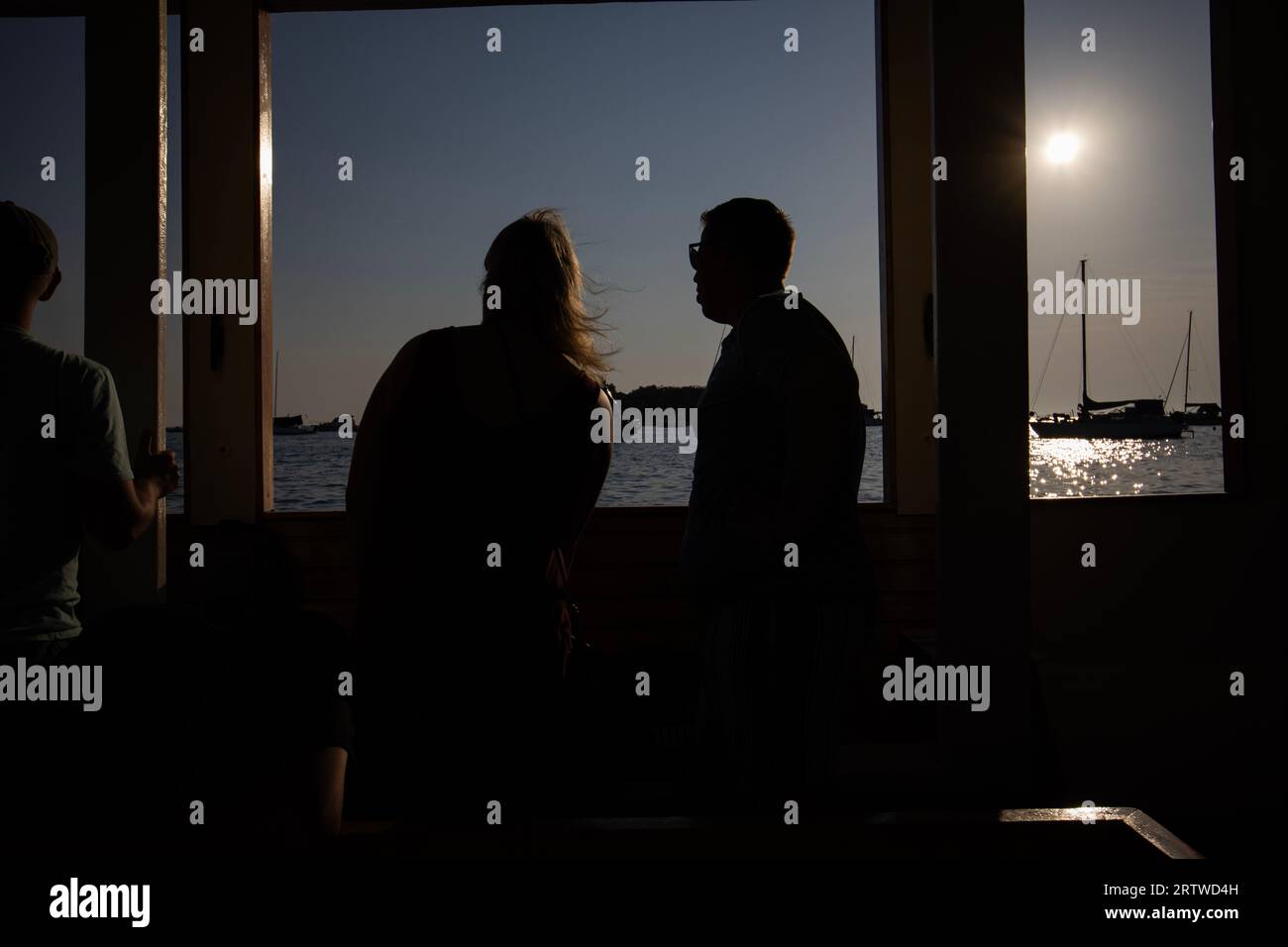 Holidaymakers enjoying a boat trip to view the various fish in the ...