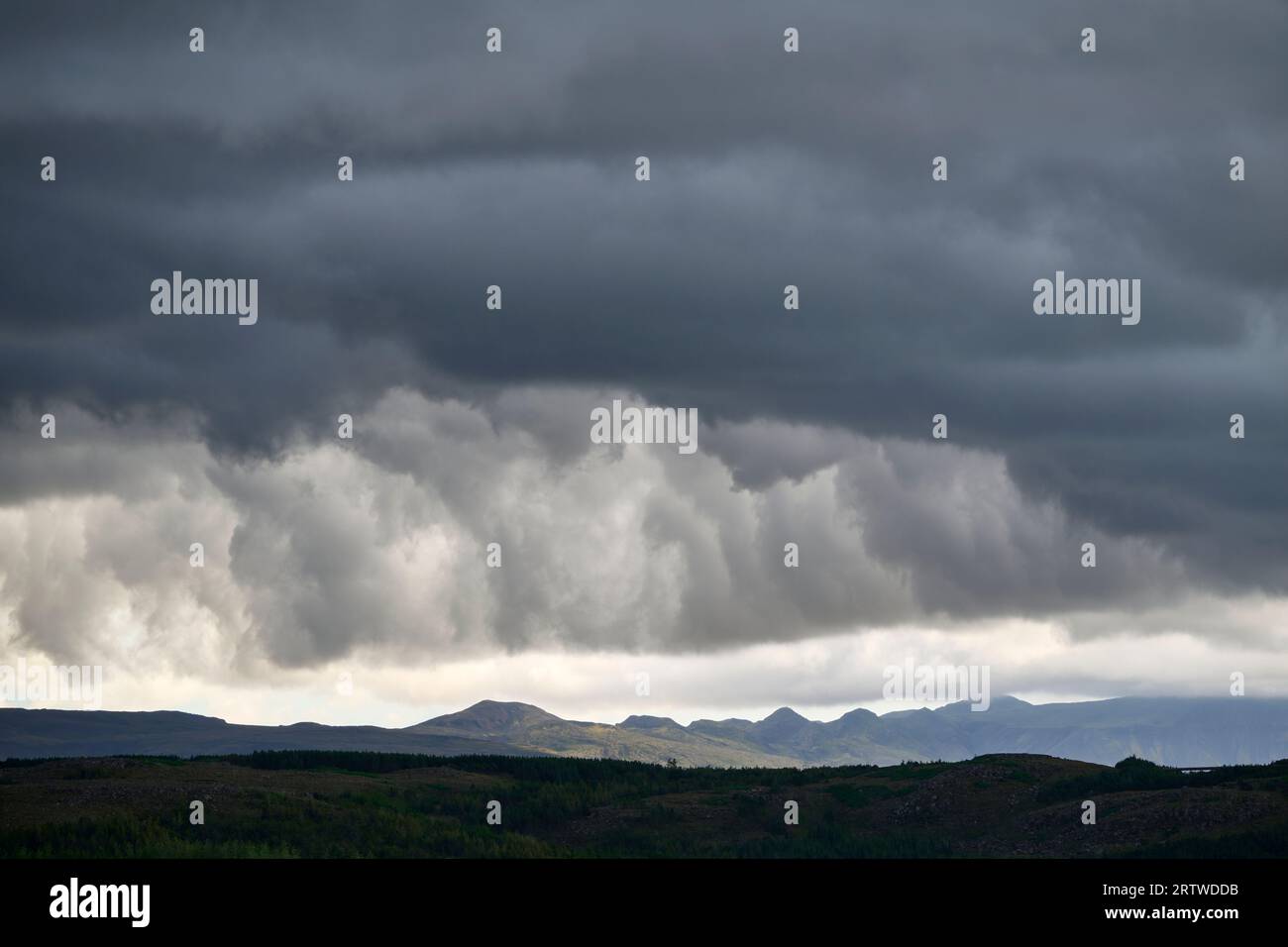 Heavy clouds of storm above mountain ridge Stock Photo - Alamy