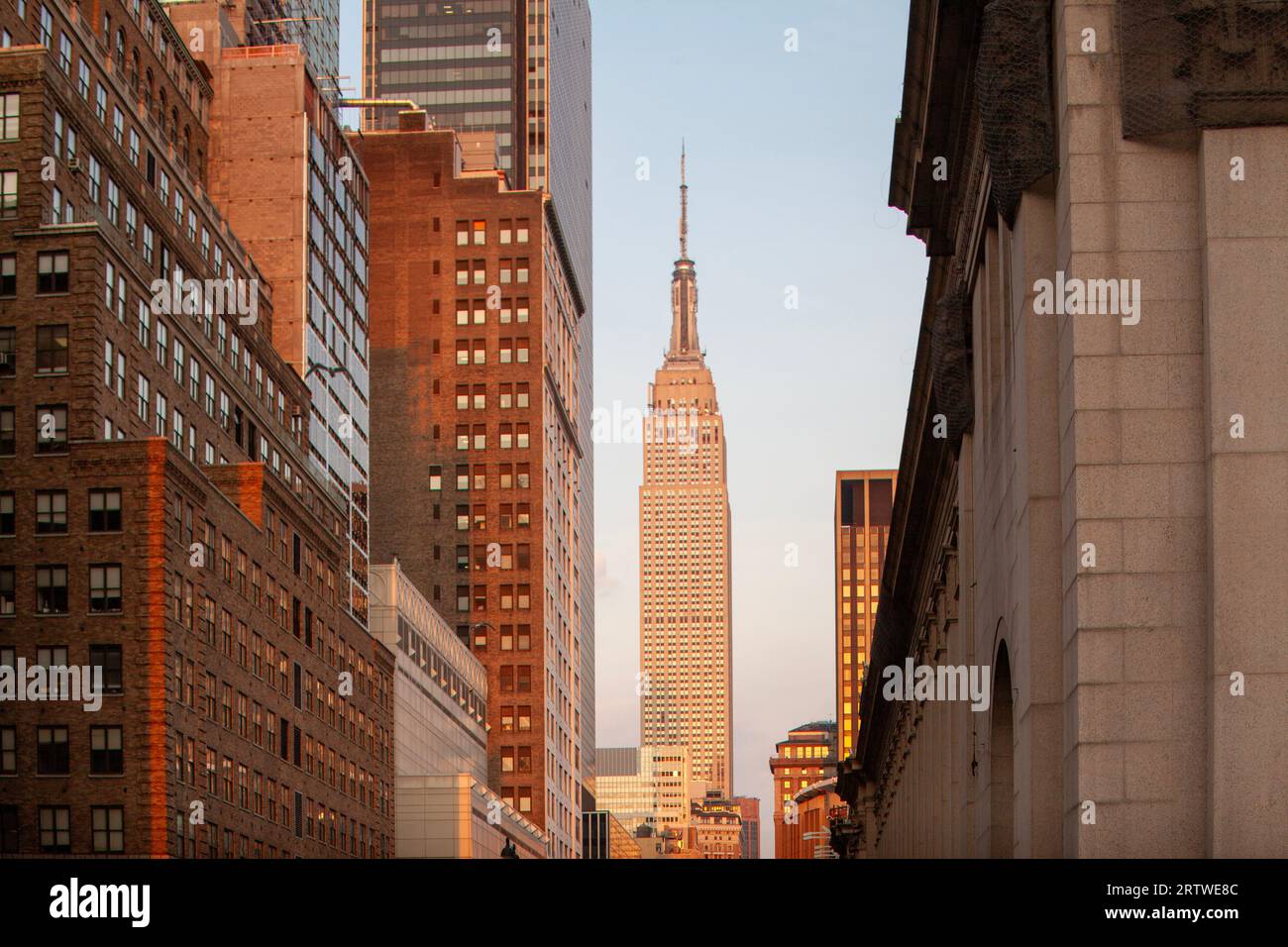 The Empire State Building framed by buildings in New York City Stock ...
