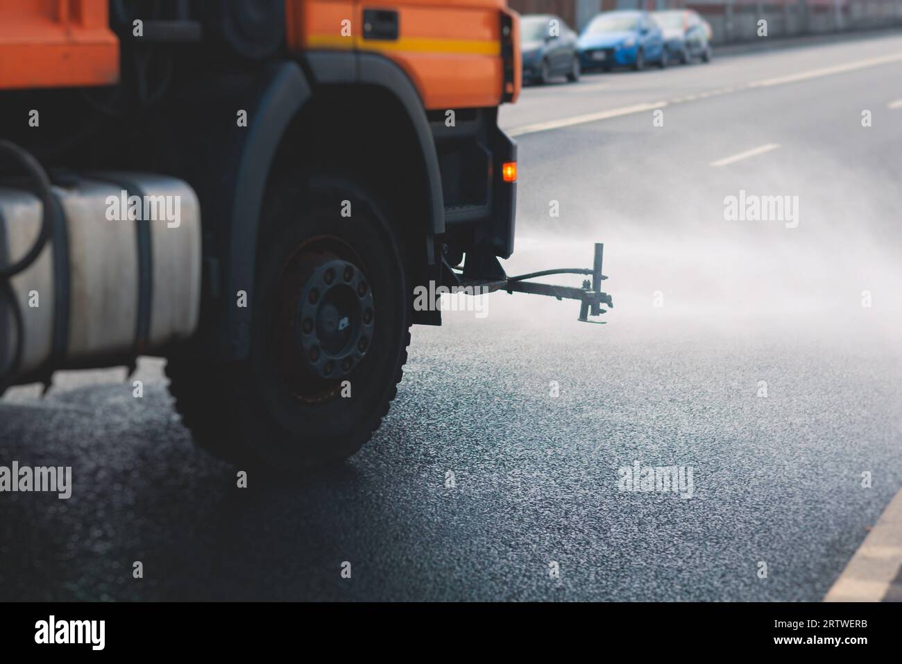 Municipal watering truck machines washes asphalt, process of street ...