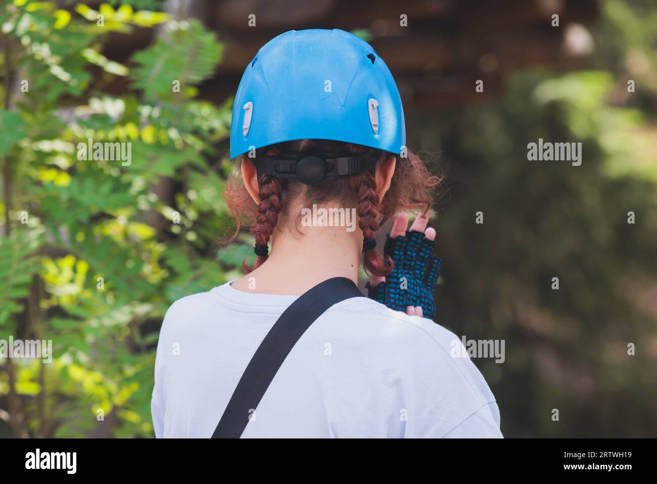 View of high ropes course, kids of climbing in amusement acitivity rope ...