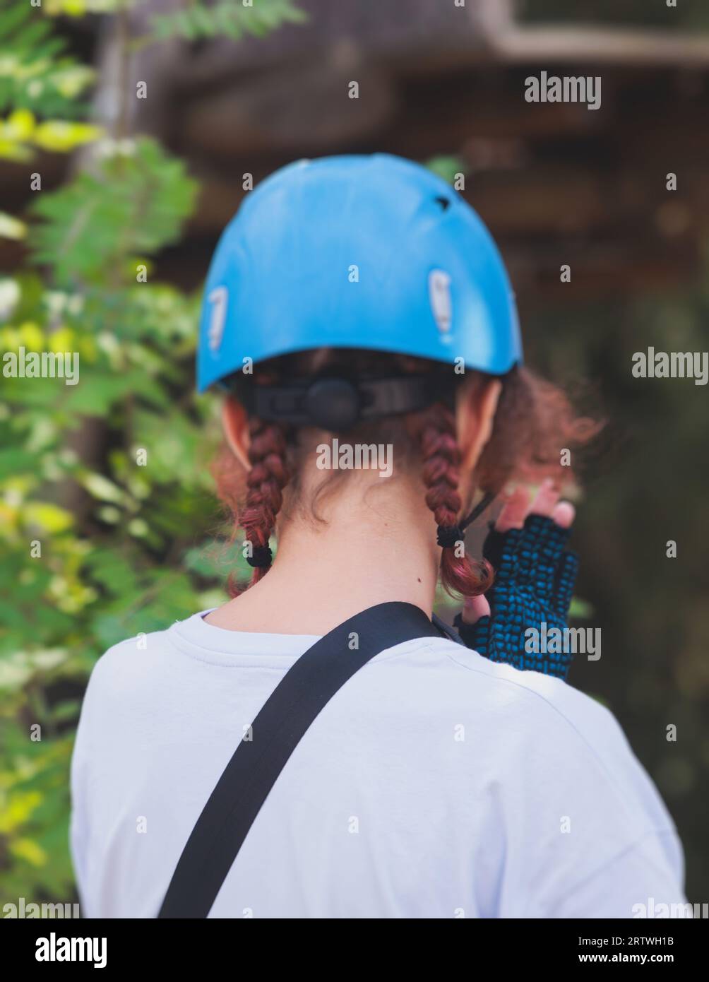 View of high ropes course, kids of climbing in amusement acitivity rope ...