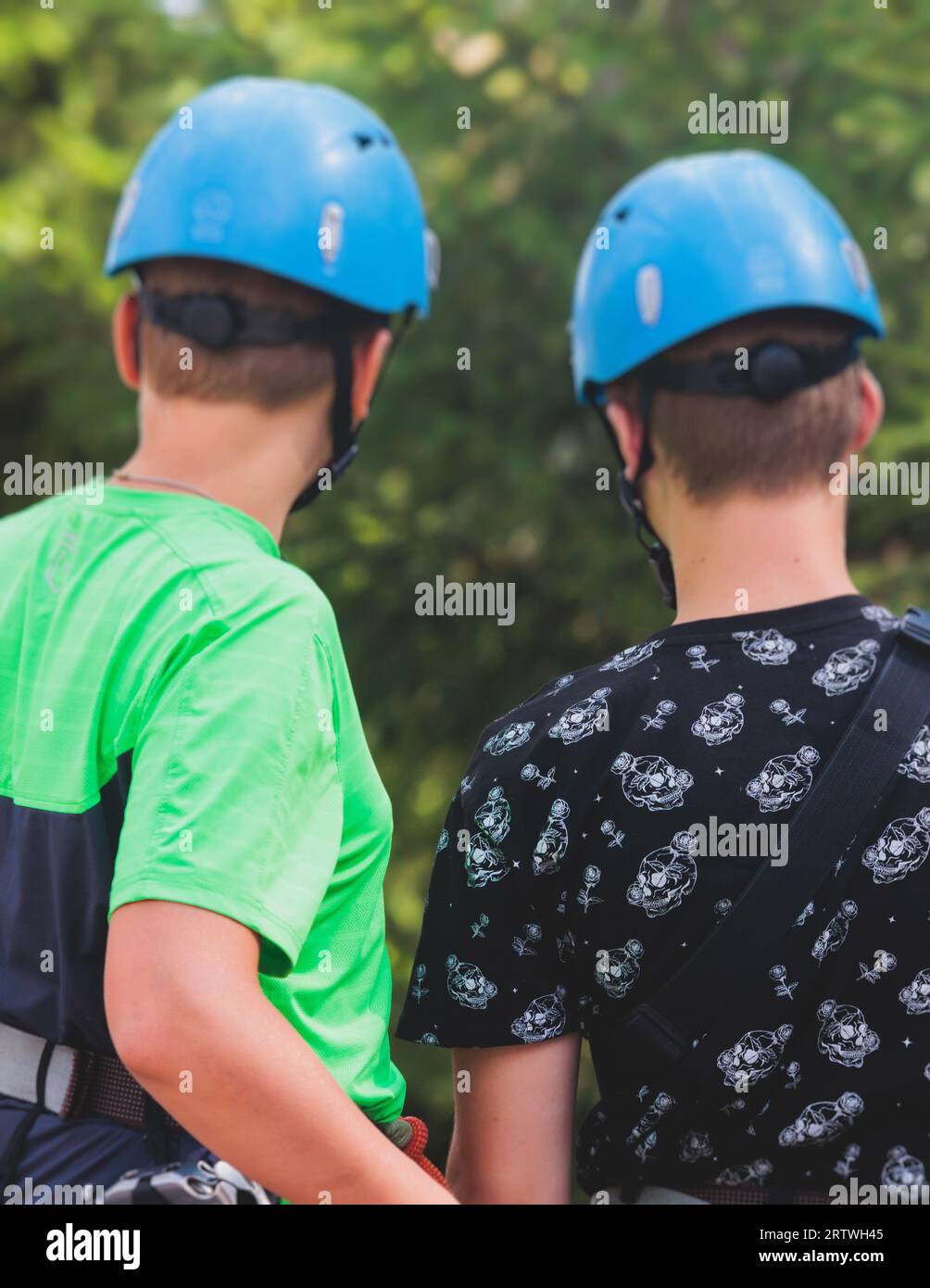 View of high ropes course, kids of climbing in amusement acitivity rope ...
