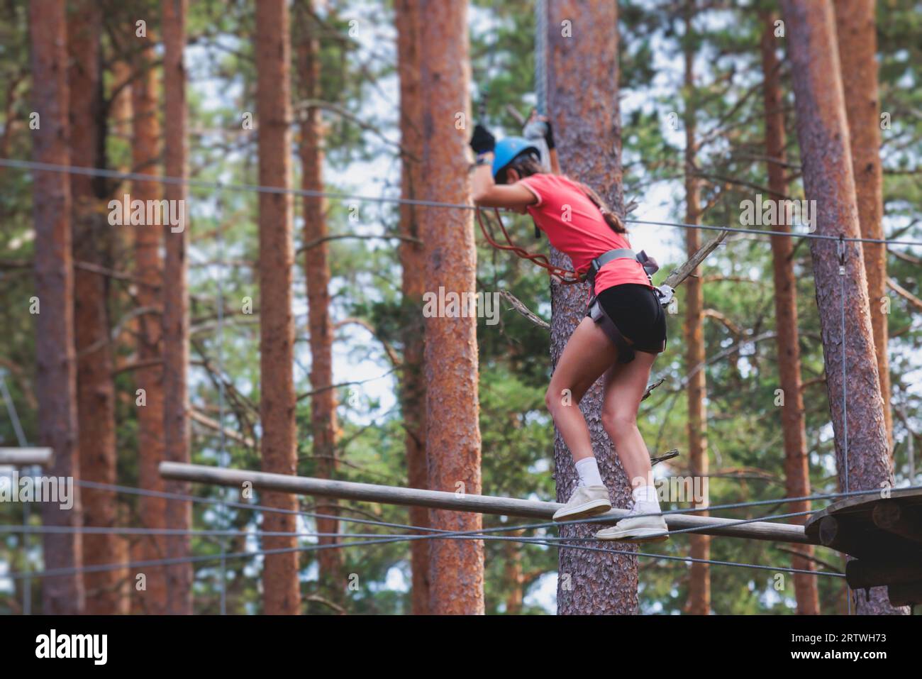 View of high ropes course, process of climbing in amusement acitivity ...