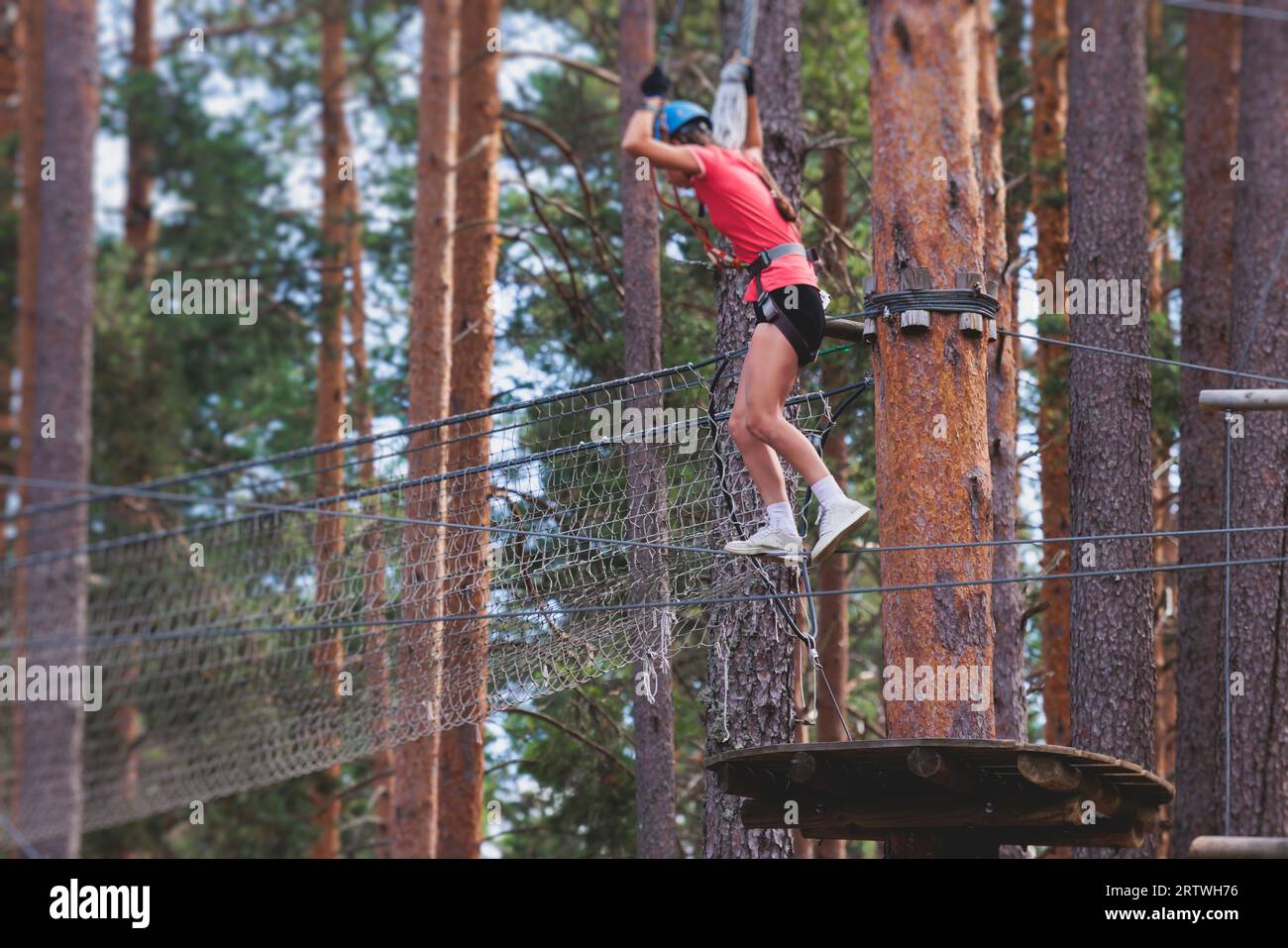 View of high ropes course, process of climbing in amusement acitivity ...