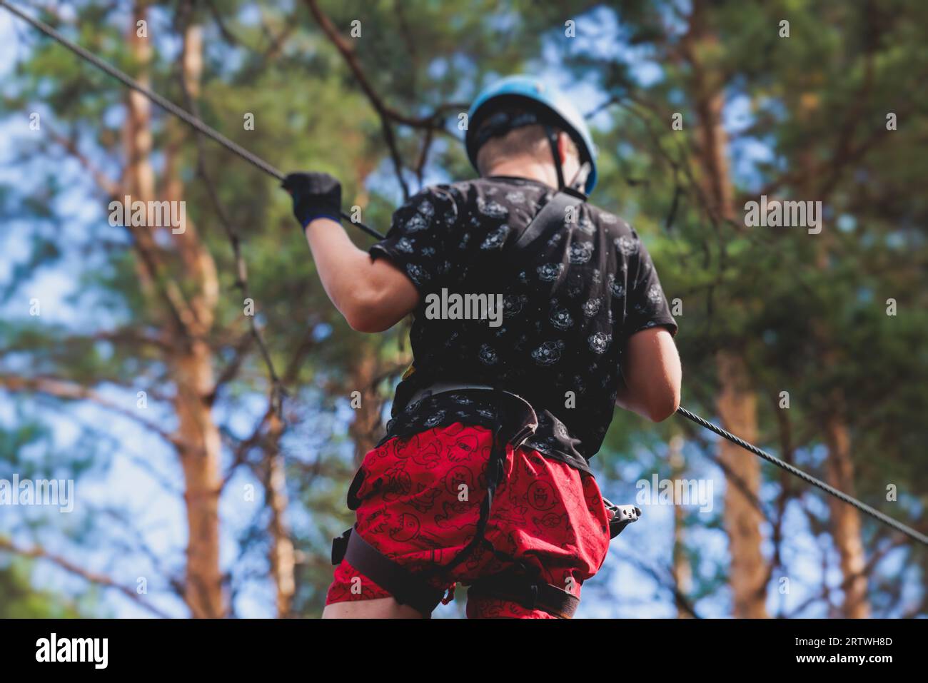 View of high ropes course, process of climbing in amusement acitivity ...