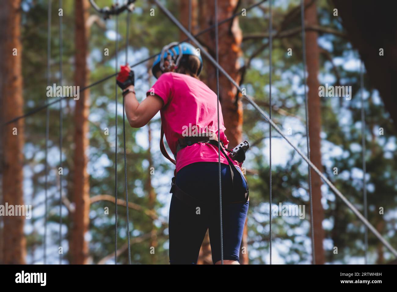 View of high ropes course, process of climbing in amusement acitivity ...