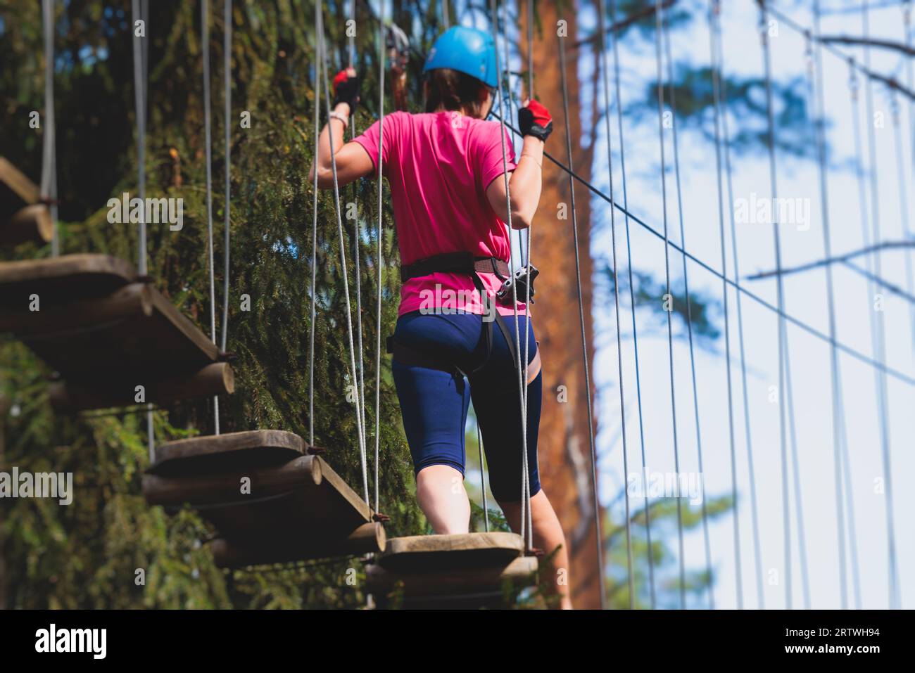 View of high ropes course, process of climbing in amusement acitivity ...