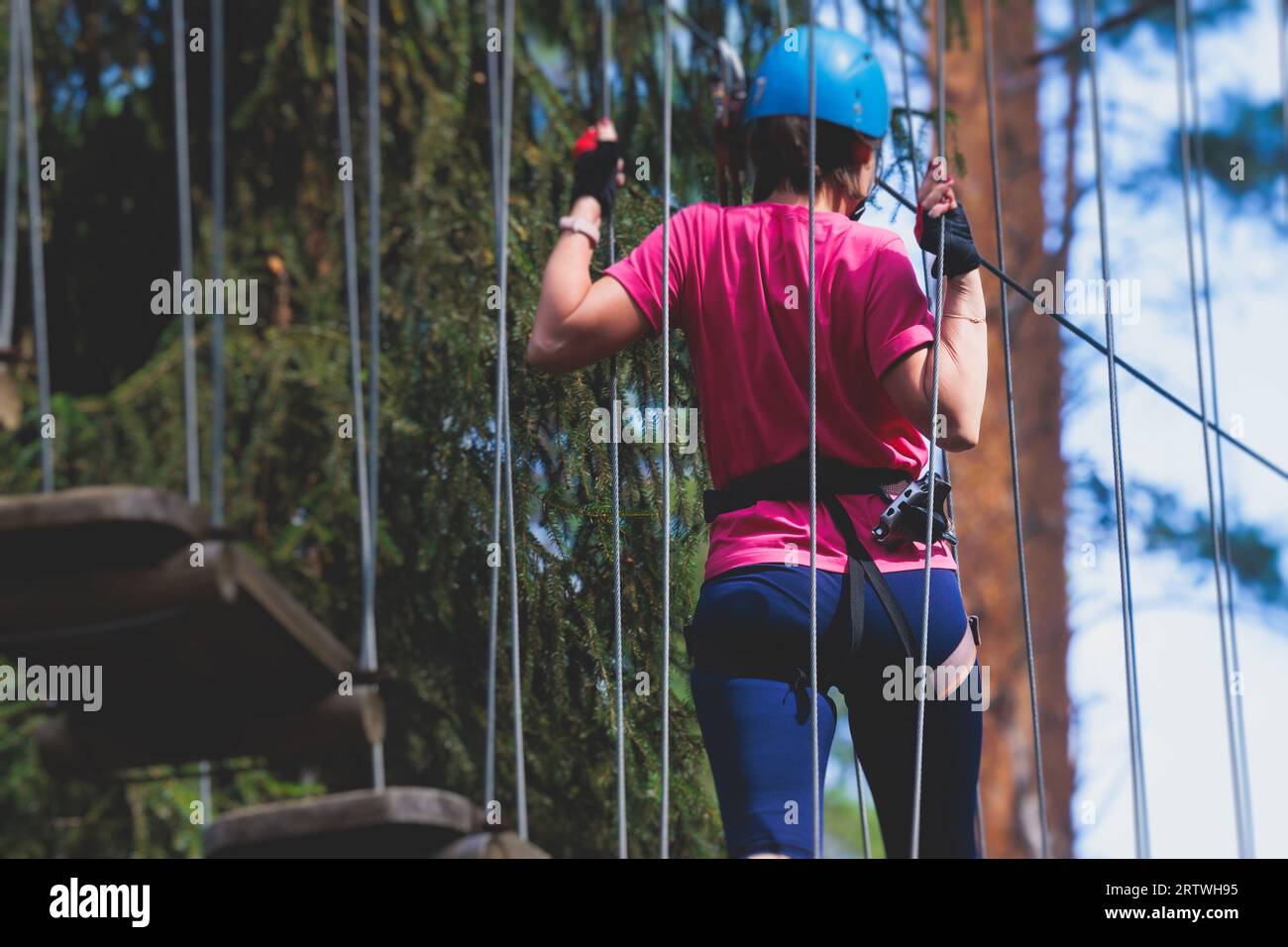 View of high ropes course, process of climbing in amusement acitivity ...