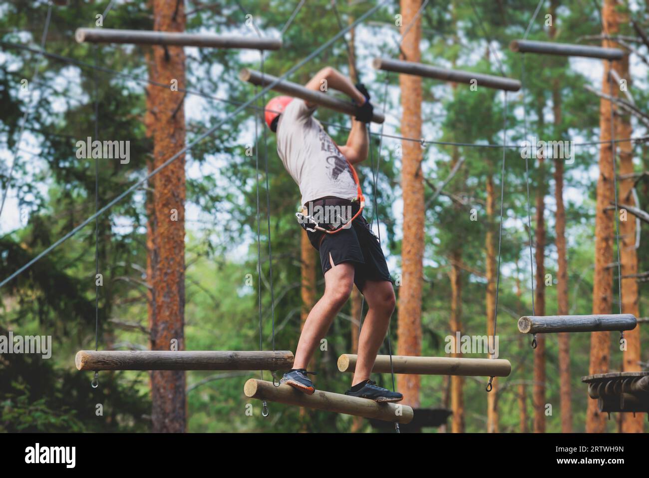 View of high ropes course, process of climbing in amusement acitivity ...