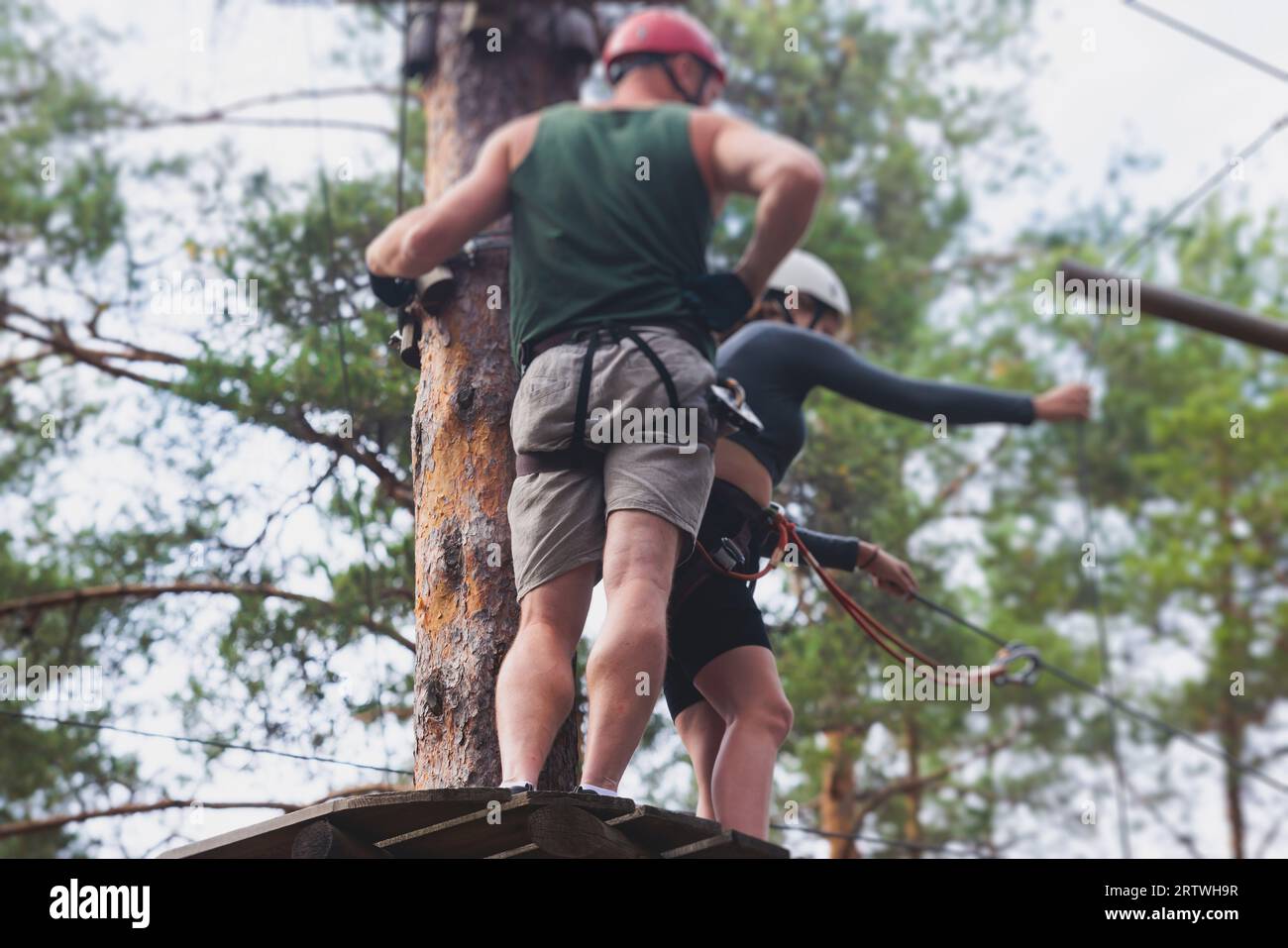 View of high ropes course, process of climbing in amusement acitivity ...