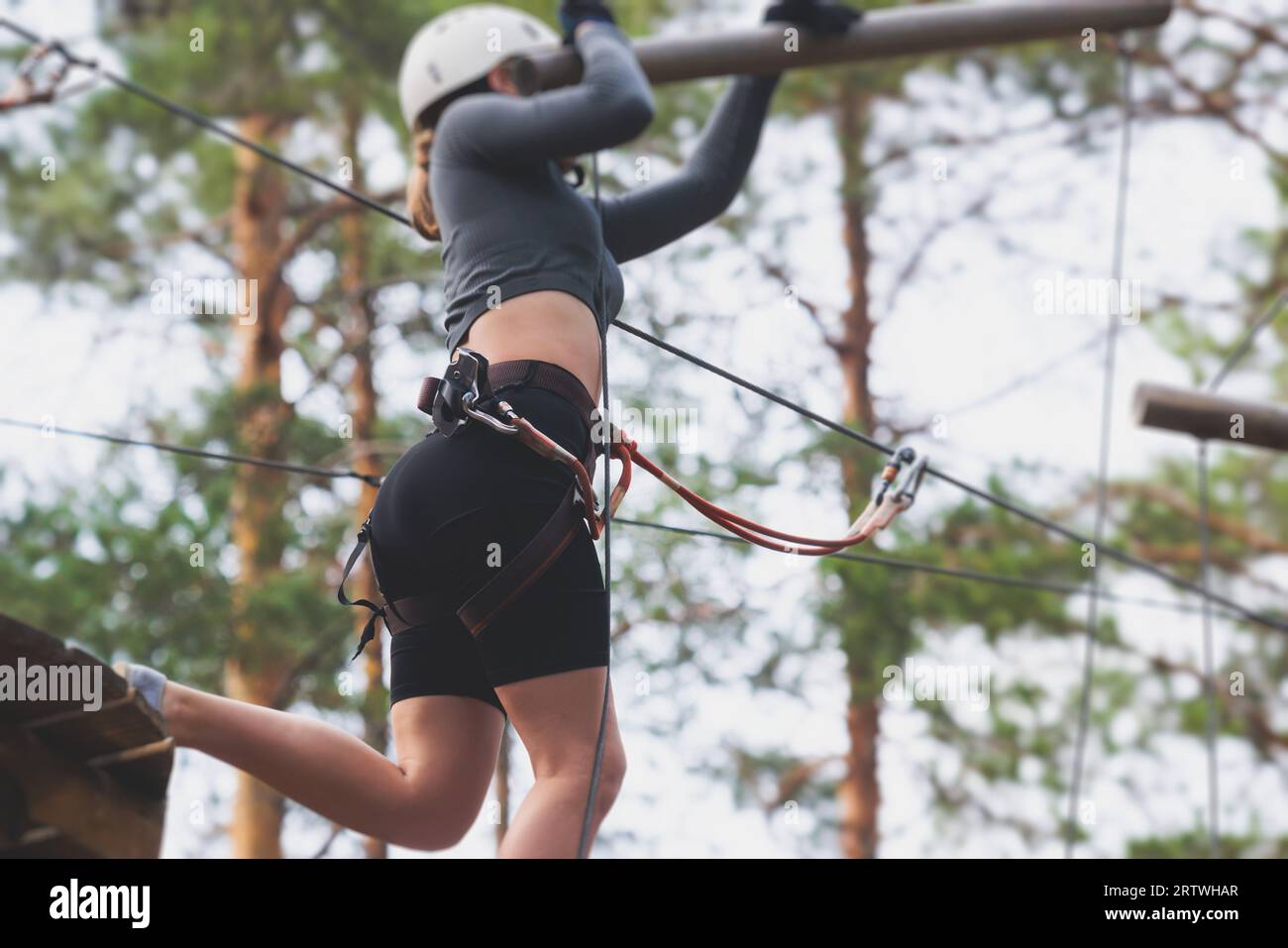 View of high ropes course, process of climbing in amusement acitivity ...