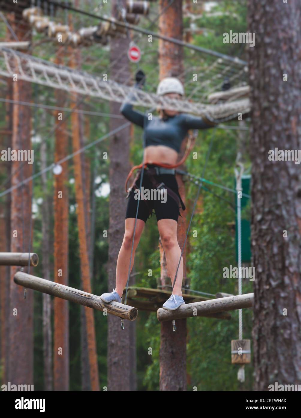 View of high ropes course, process of climbing in amusement acitivity ...