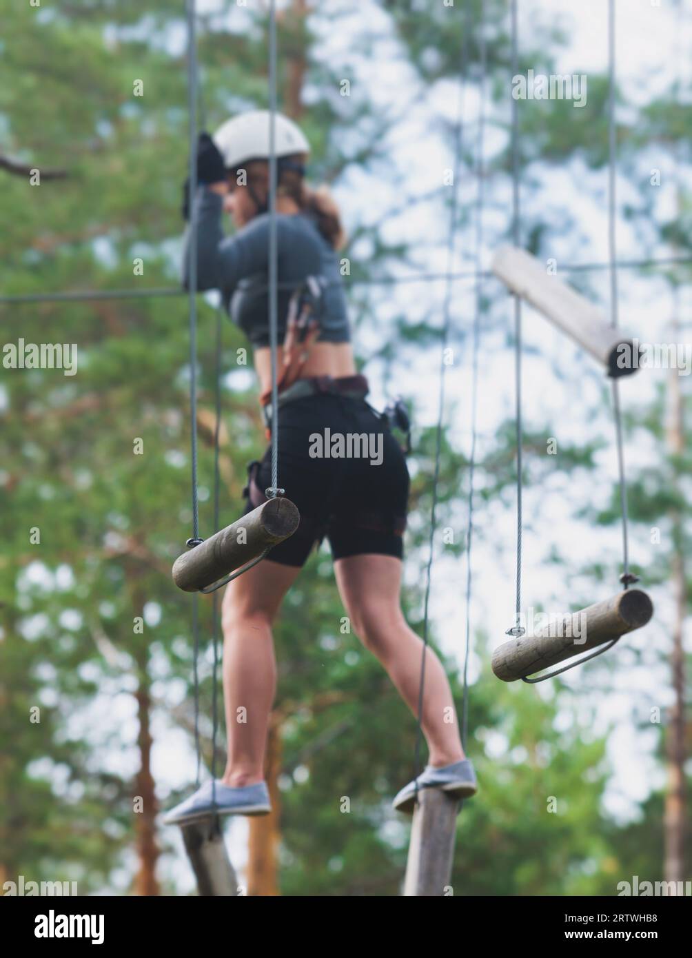 View of high ropes course, process of climbing in amusement acitivity ...