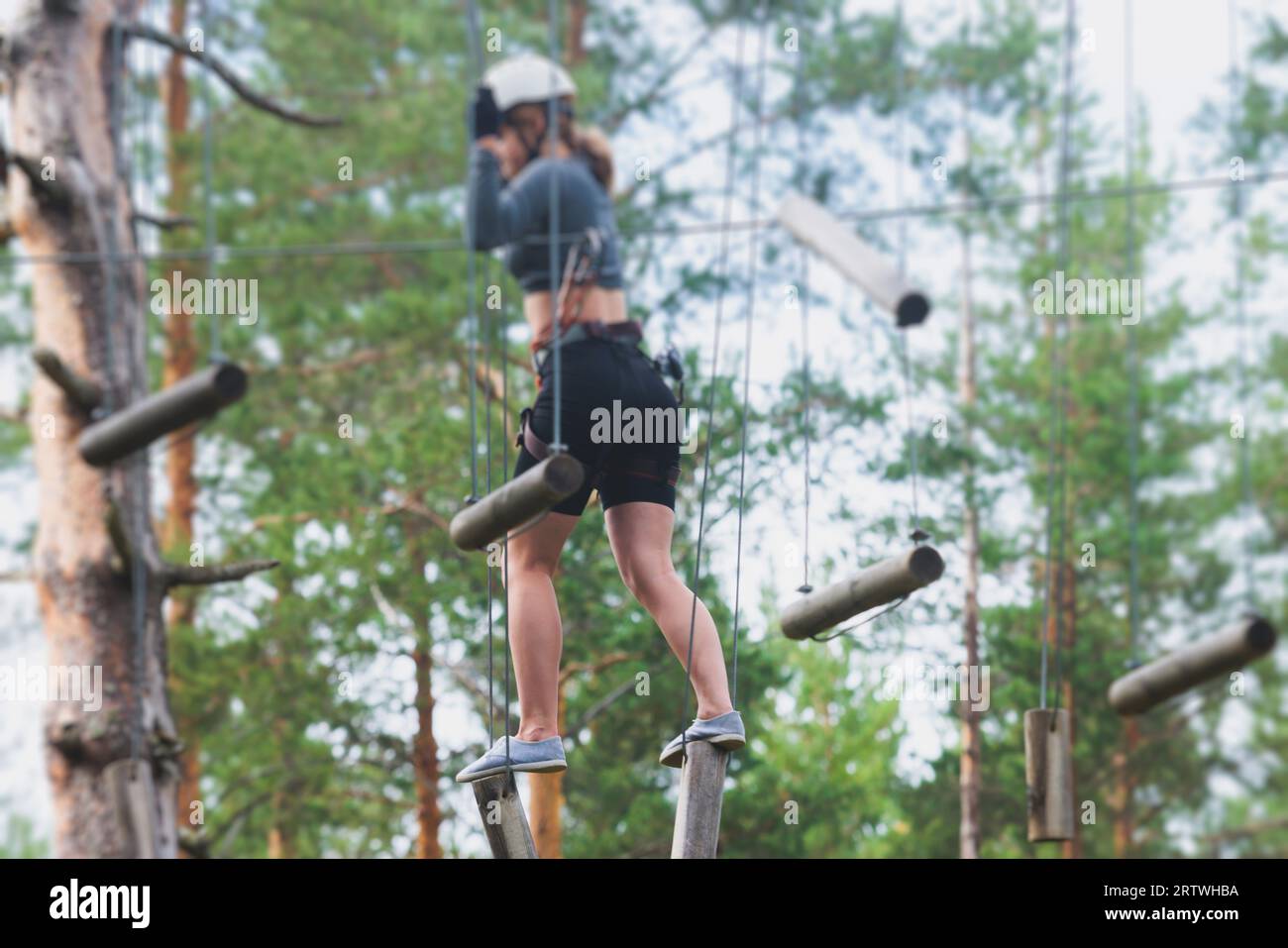 View of high ropes course, process of climbing in amusement acitivity ...