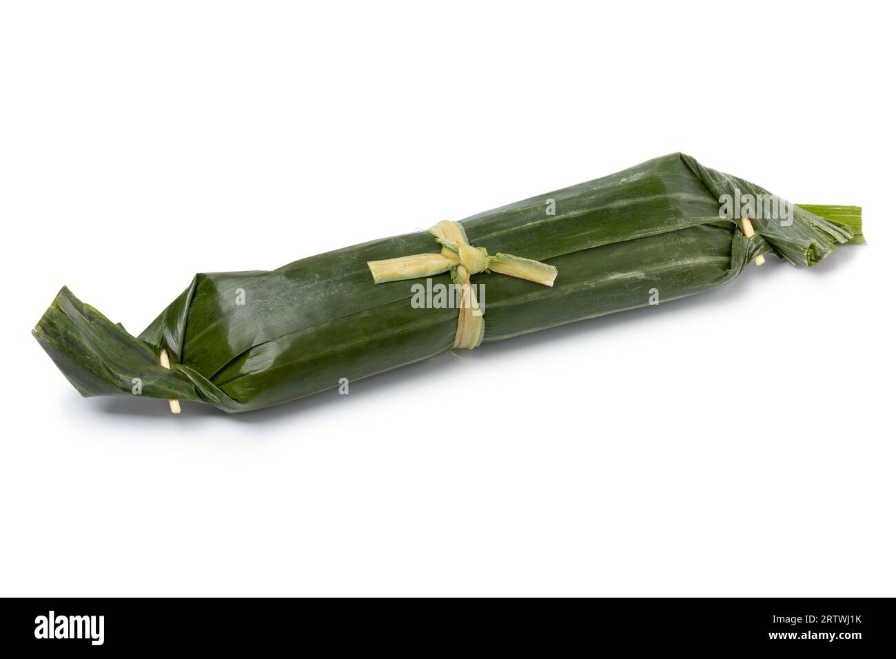 Single whole Lemper wrapped in banana leaves, an Indonesian savoury ...
