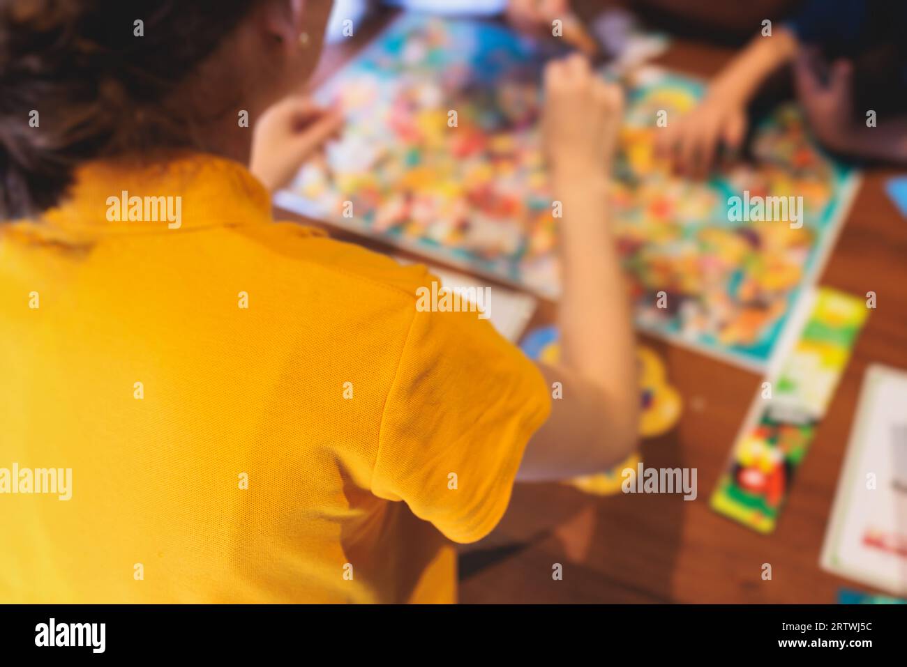Process of playing board game and having fun with friends and family in ...