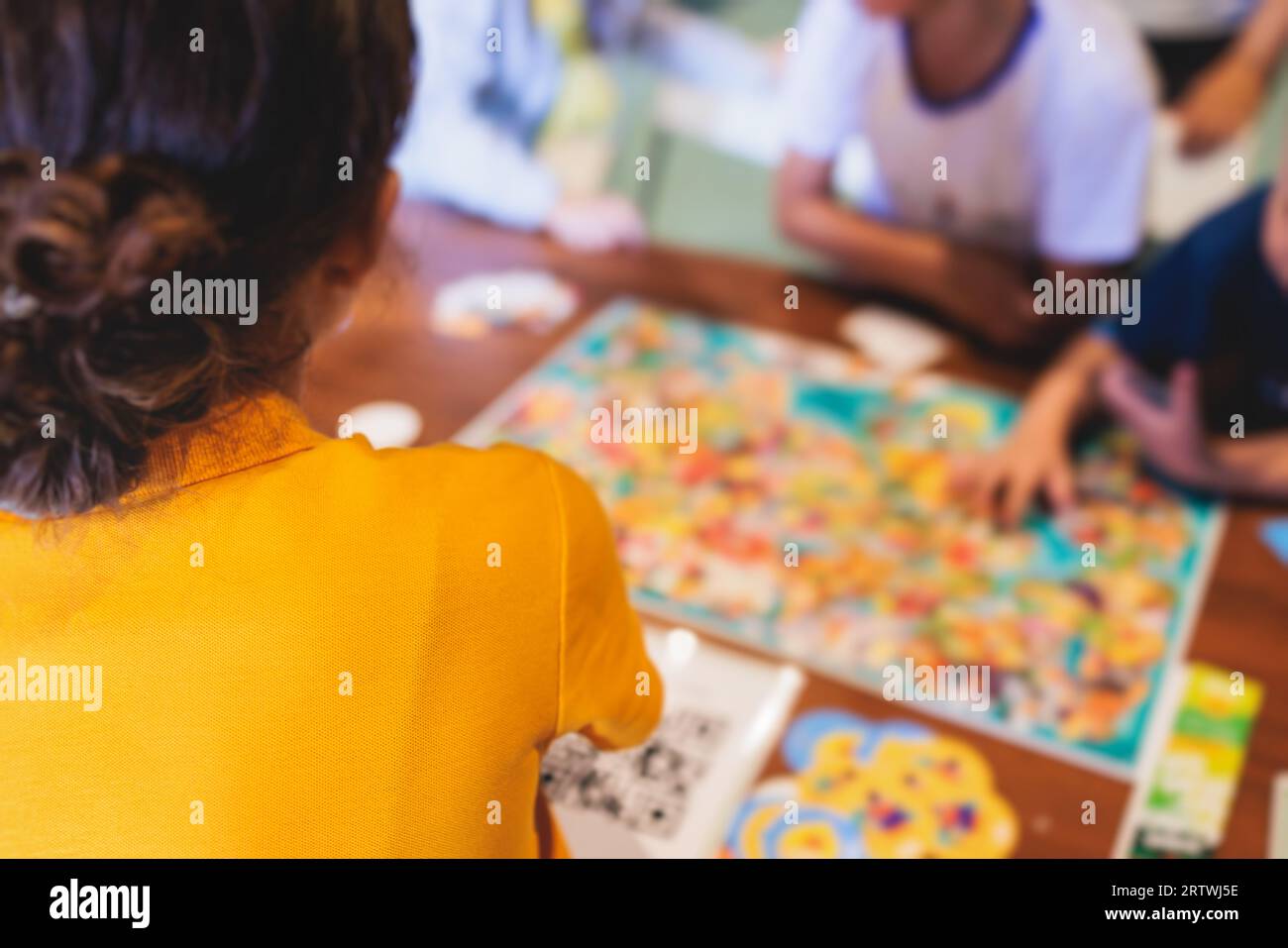 Process of playing board game and having fun with friends and family in ...