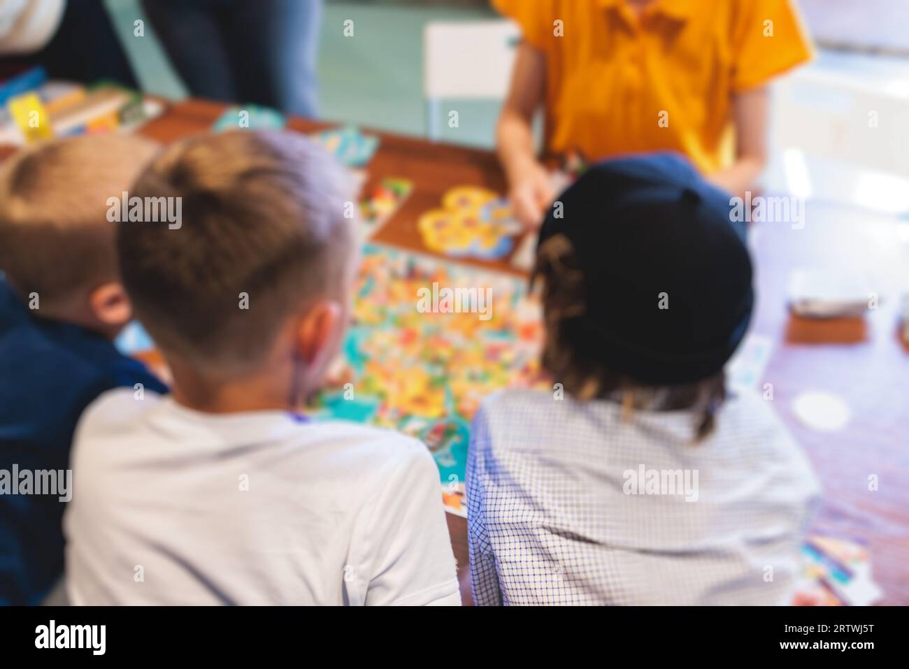 Process of playing board game and having fun with friends and family in ...