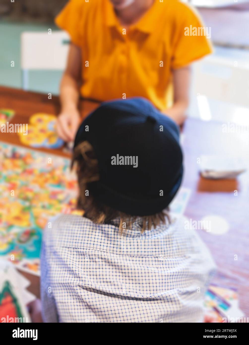 Process of playing board game and having fun with friends and family in ...