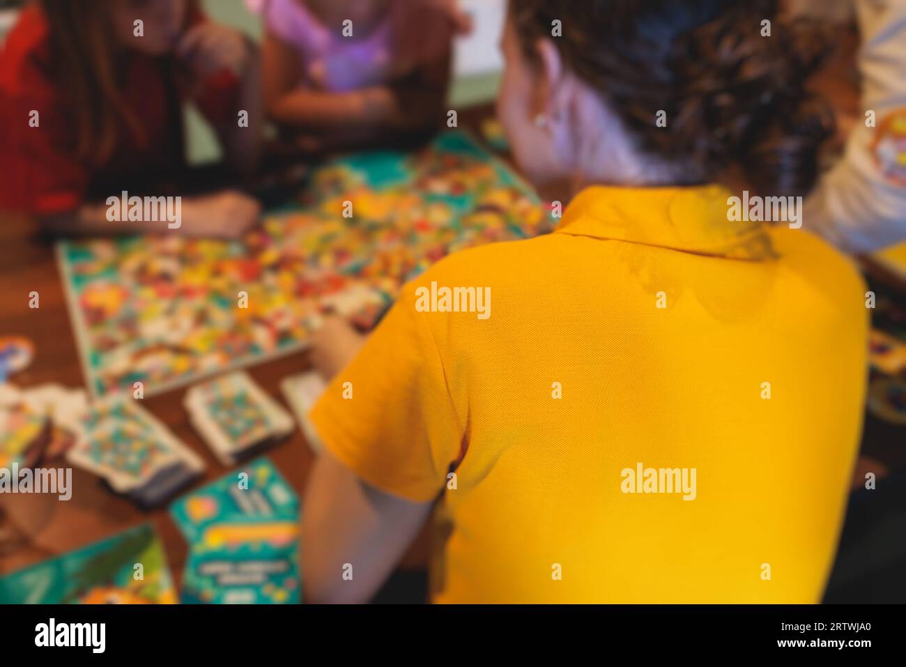 Process of playing board game and having fun with friends and family in ...