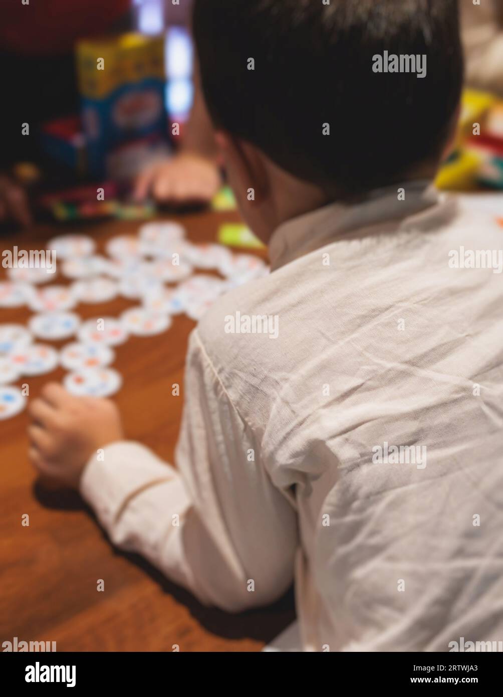 Process of playing board game and having fun with friends and family in ...