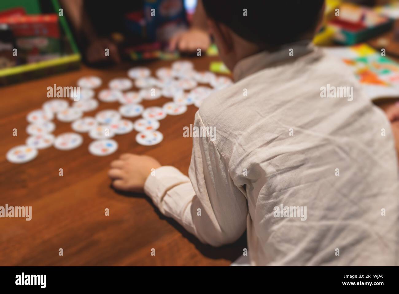 Process of playing board game and having fun with friends and family in ...