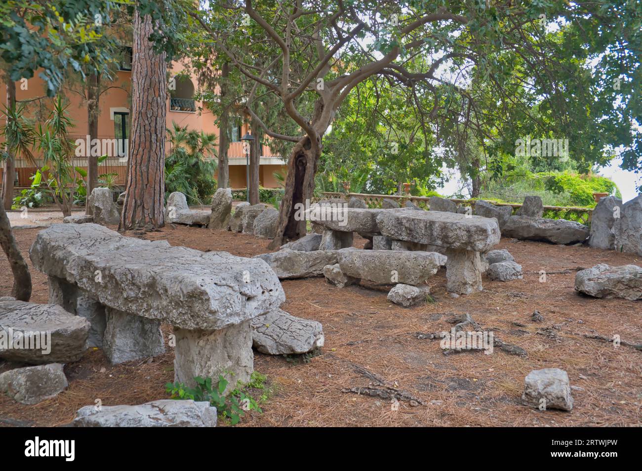 ancient stone table ruins, in the municipal park of Taormina called ...