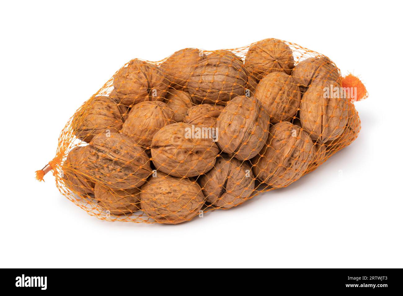 Net with whole walnuts in the shell isolated on white background close ...