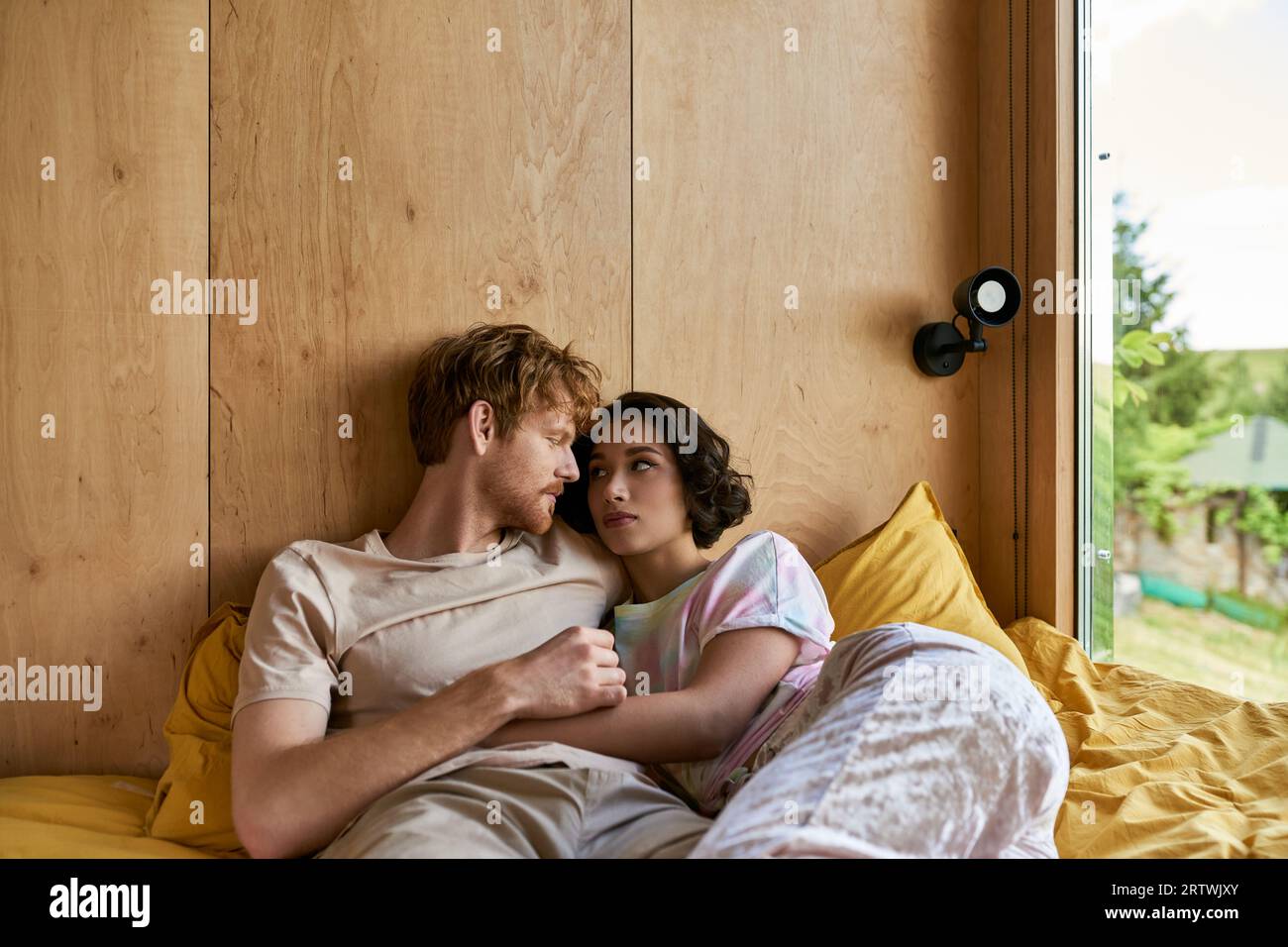 Interracial Couple Having Tender Moment While Lying Together On Bed And 1931