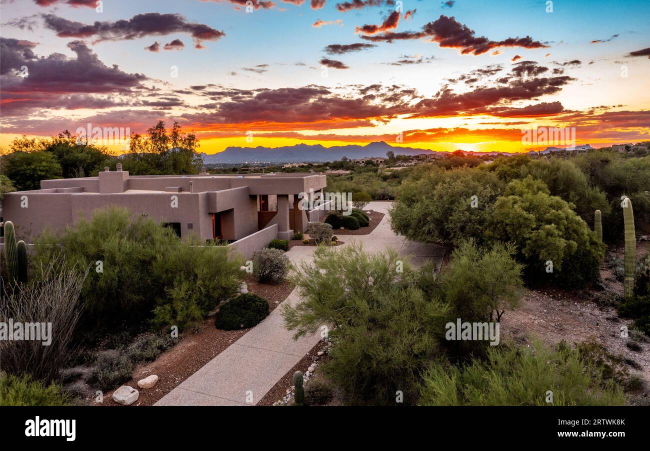 Aerial view of a residential neighbourhood, with a paved road winding ...