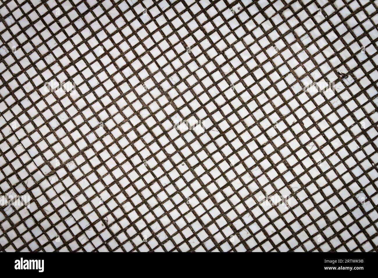 Texture of the old tile wall. Square white small tiles on concrete ...