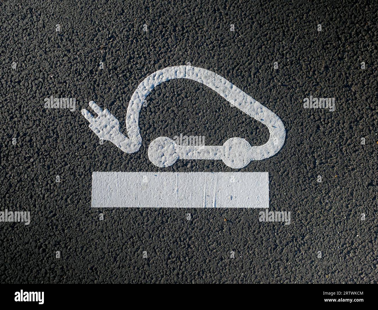 Electric vehicle charger icon on asphalt, concept of high demand of EV ...