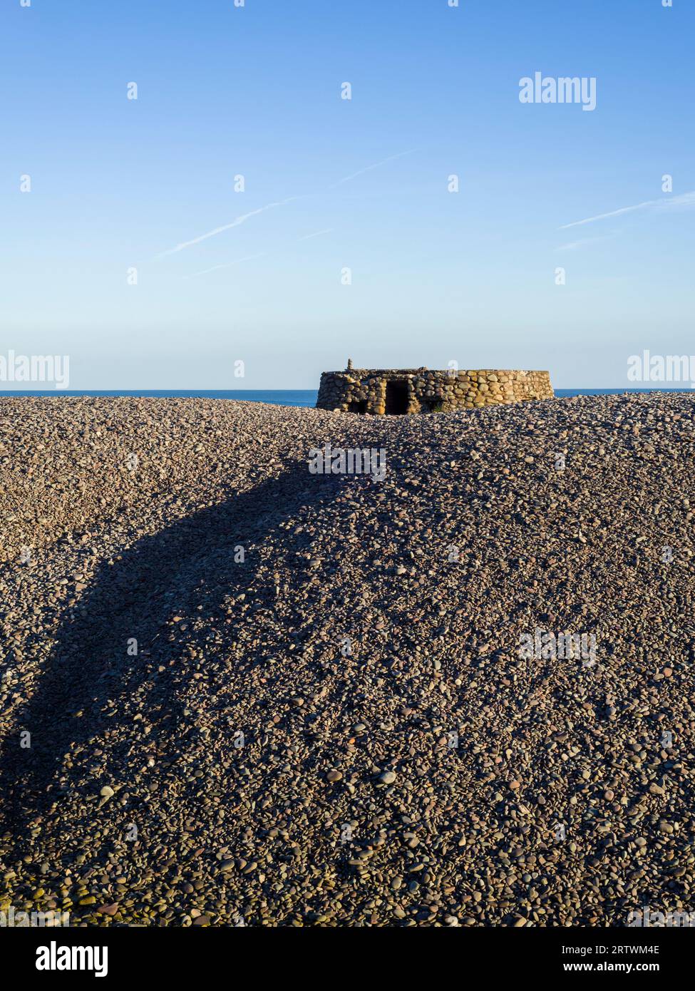 A World War Two pillbox on the pebble ridge at Bossington Beach in ...