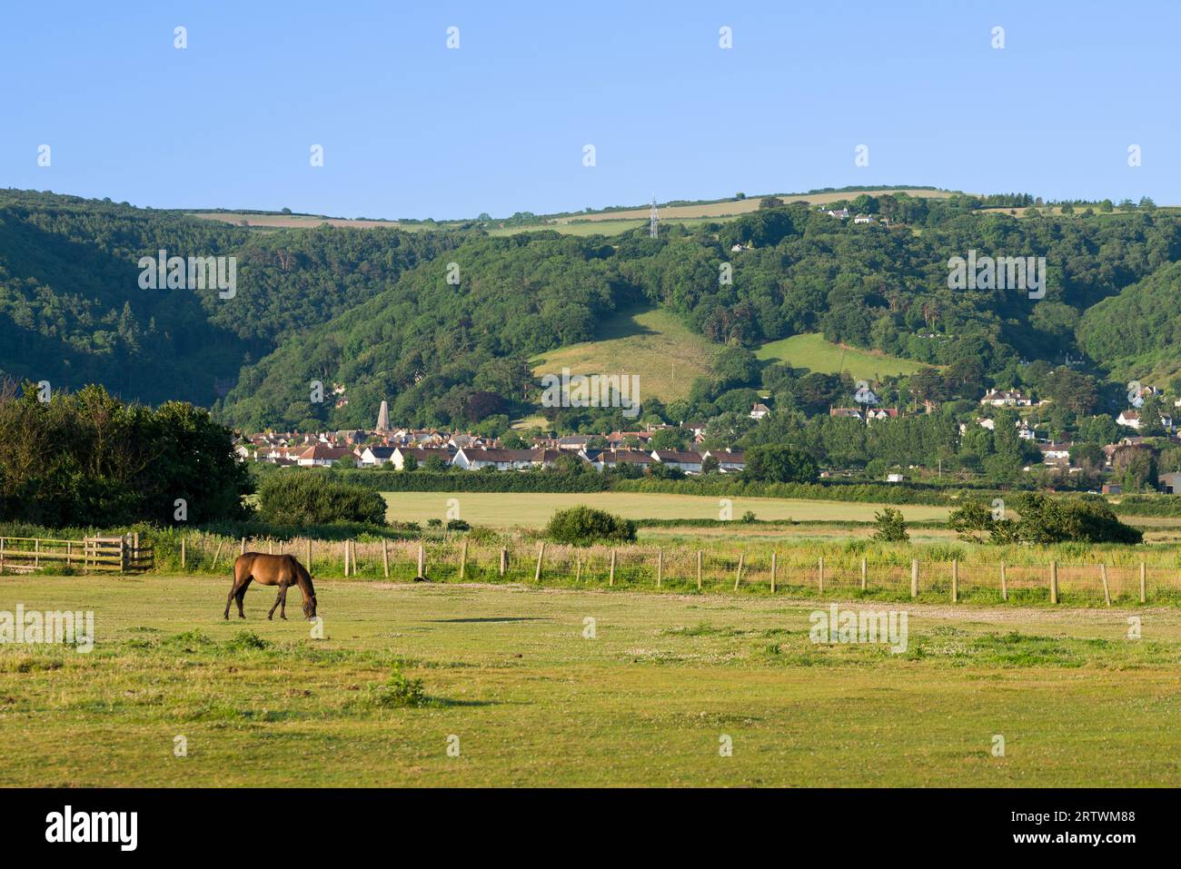 The village of Porlock nestled below the hills of Exmoor National Park ...
