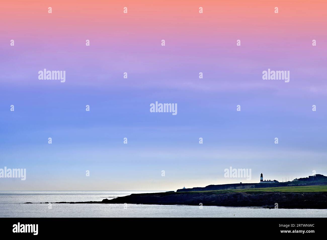 Souter Lighthouse near South Shields with fiery red and blue sky and ...